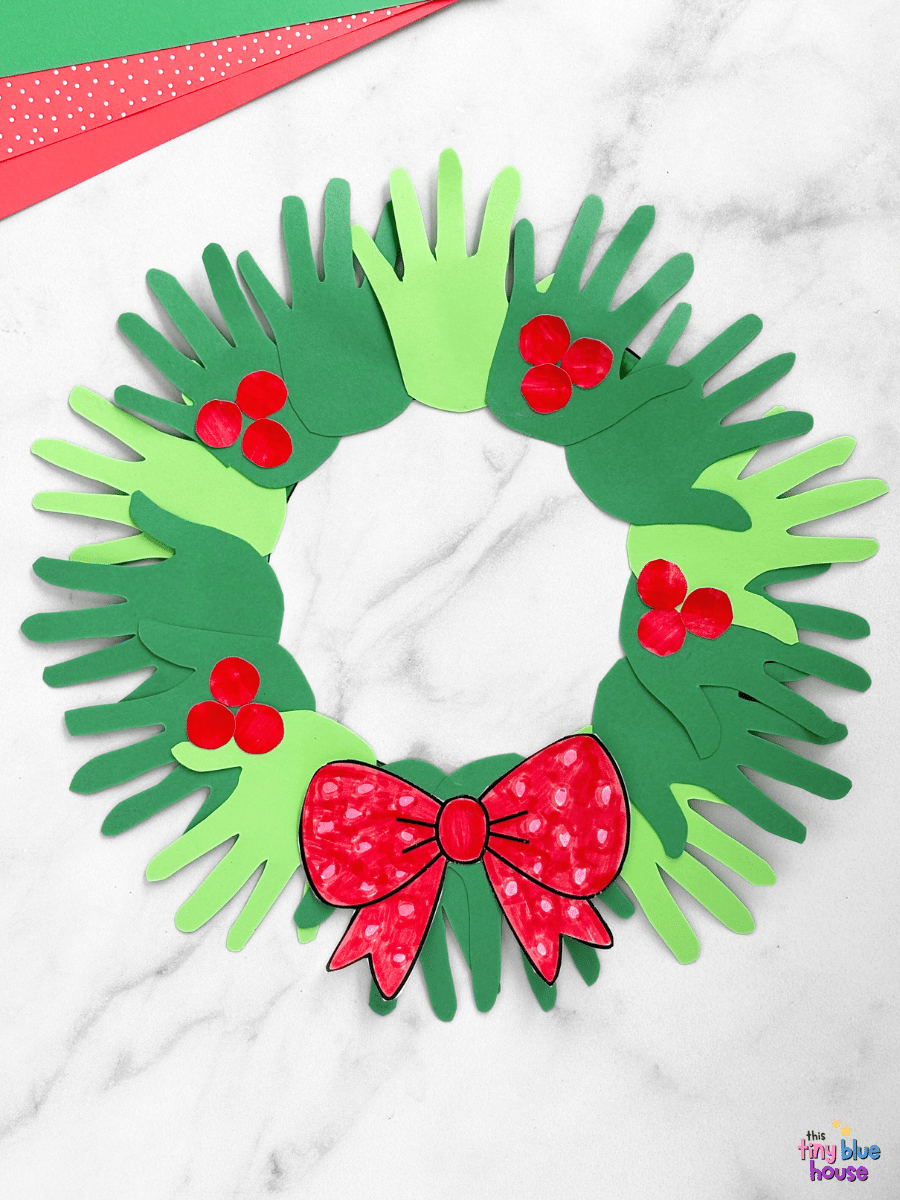 Christmas Handprint Wreath Craft (Free Printable Template) - This Tiny ...